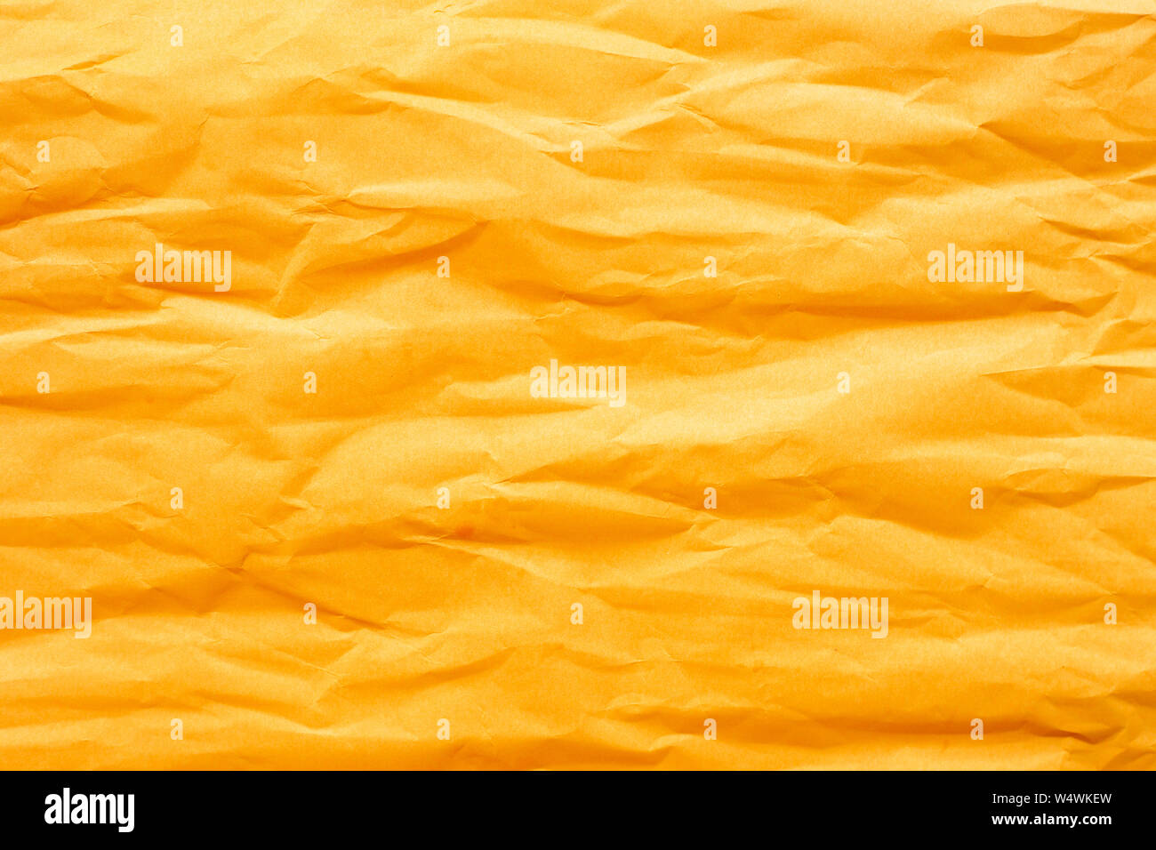 Gold yellow crumpled paper for background Stock Photo - Alamy