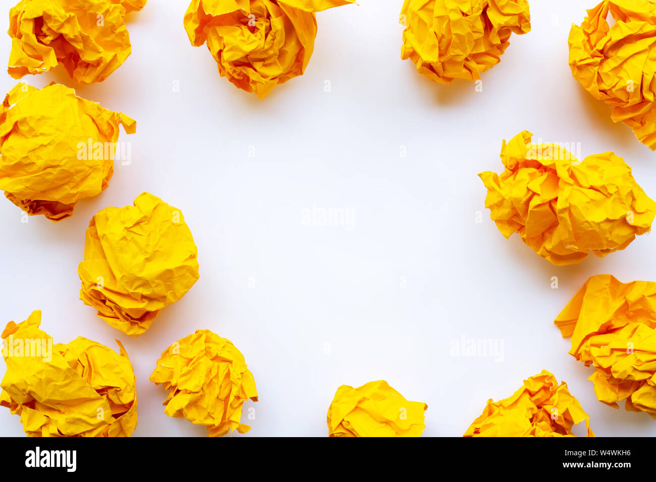 Yellow crumpled paper ball isolated on white background Stock Photo - Alamy