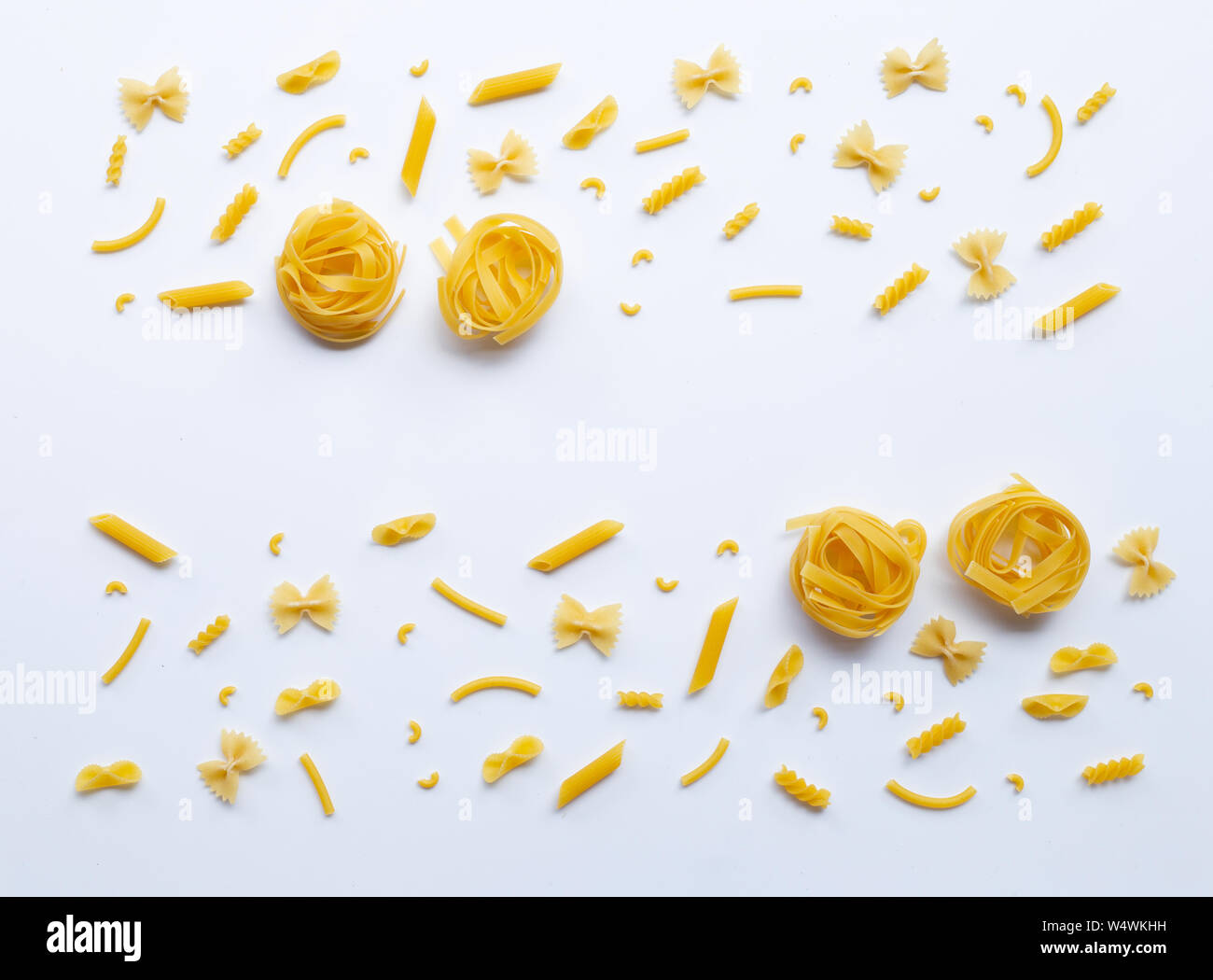 Different types of dry pasta on white background Stock Photo - Alamy