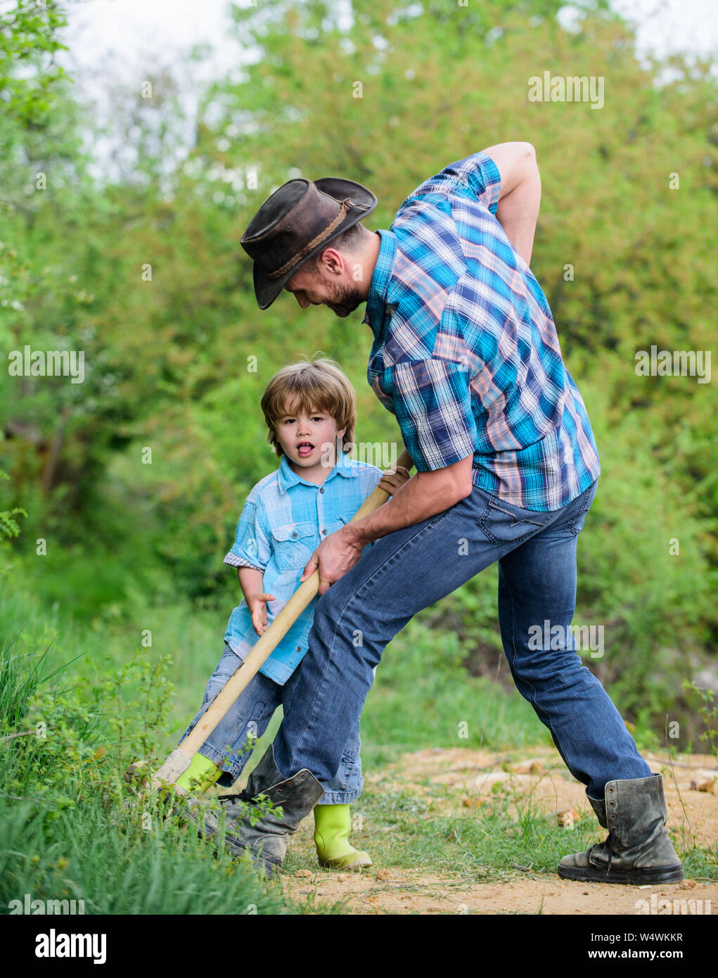 Adventure hunting for treasures. Little helper working in garden. Cute ...