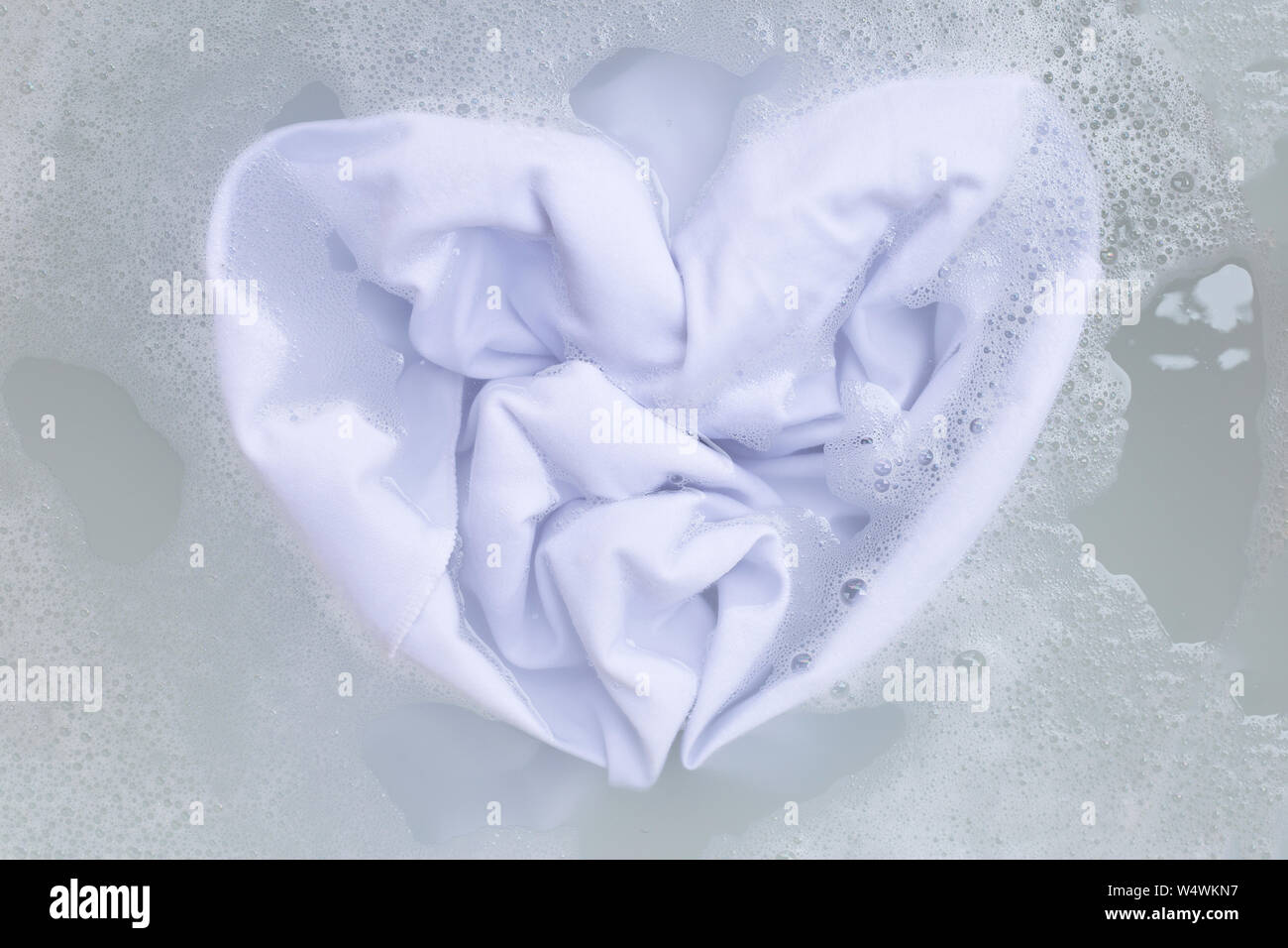 Soak a cloth before washing, white cloth. Top view Stock Photo - Alamy