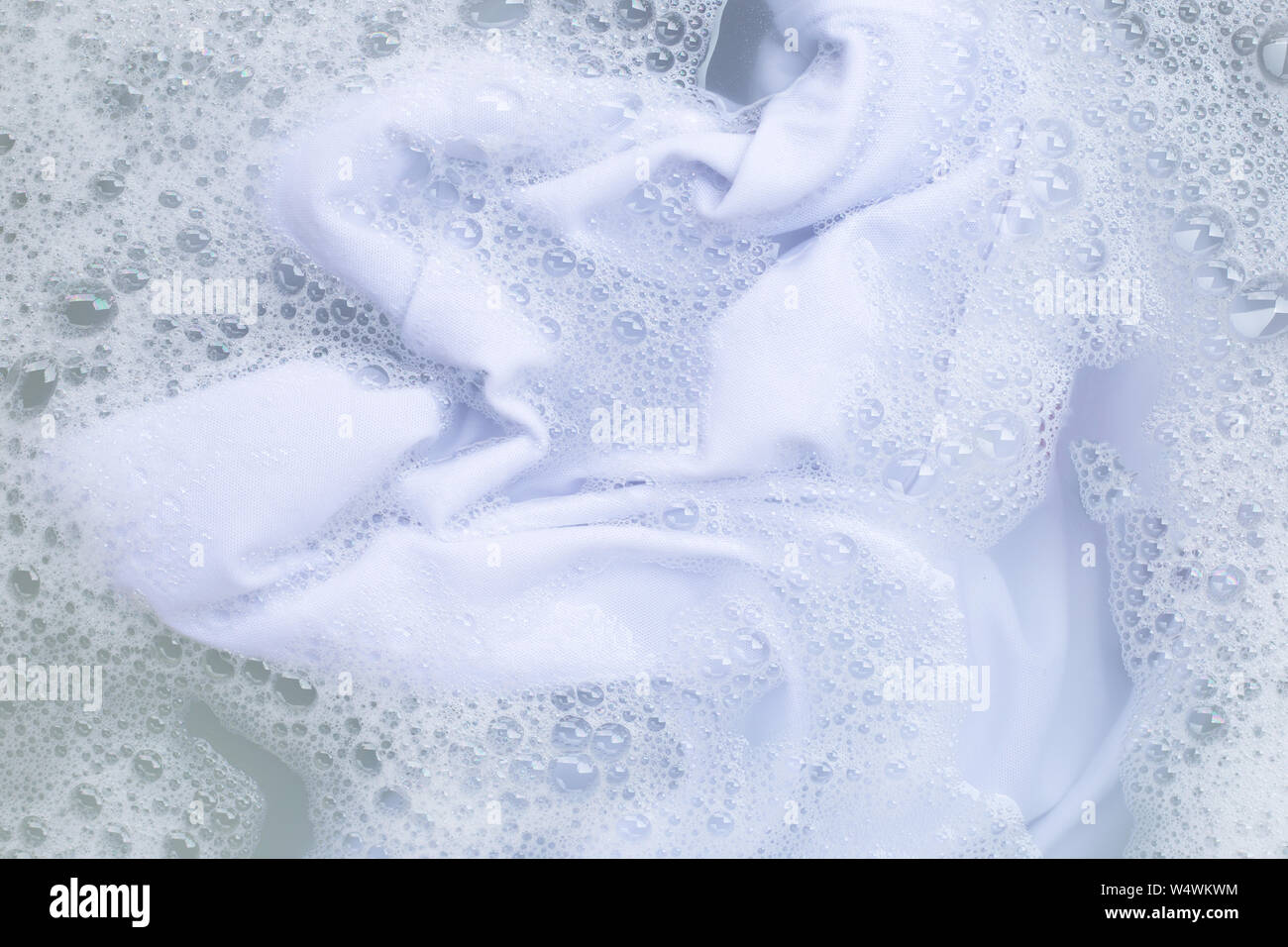 Soak a cloth before washing, white cloth. Top view Stock Photo - Alamy