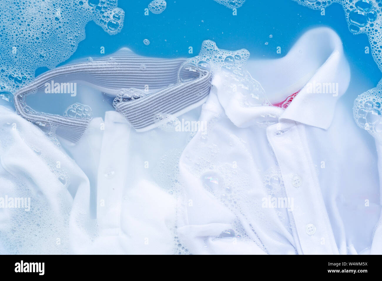 Shirt soak in powder detergent water dissolution, washing cloth ...