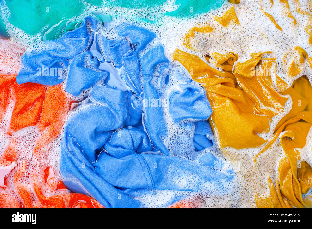 Color clothes soak before washing. Top view Stock Photo - Alamy