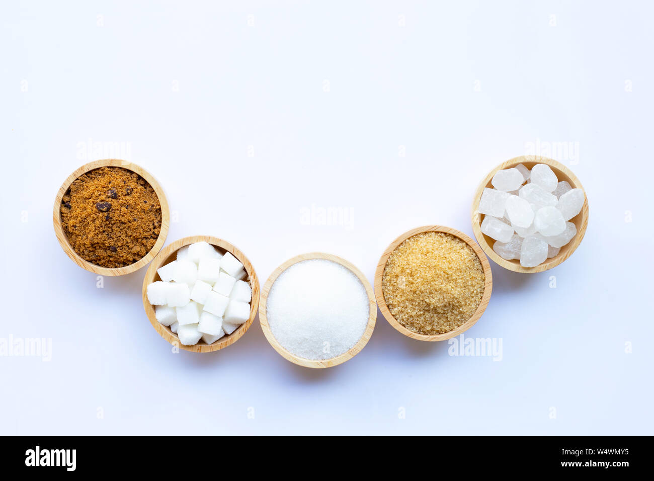 Various types of sugar on white background Stock Photo - Alamy