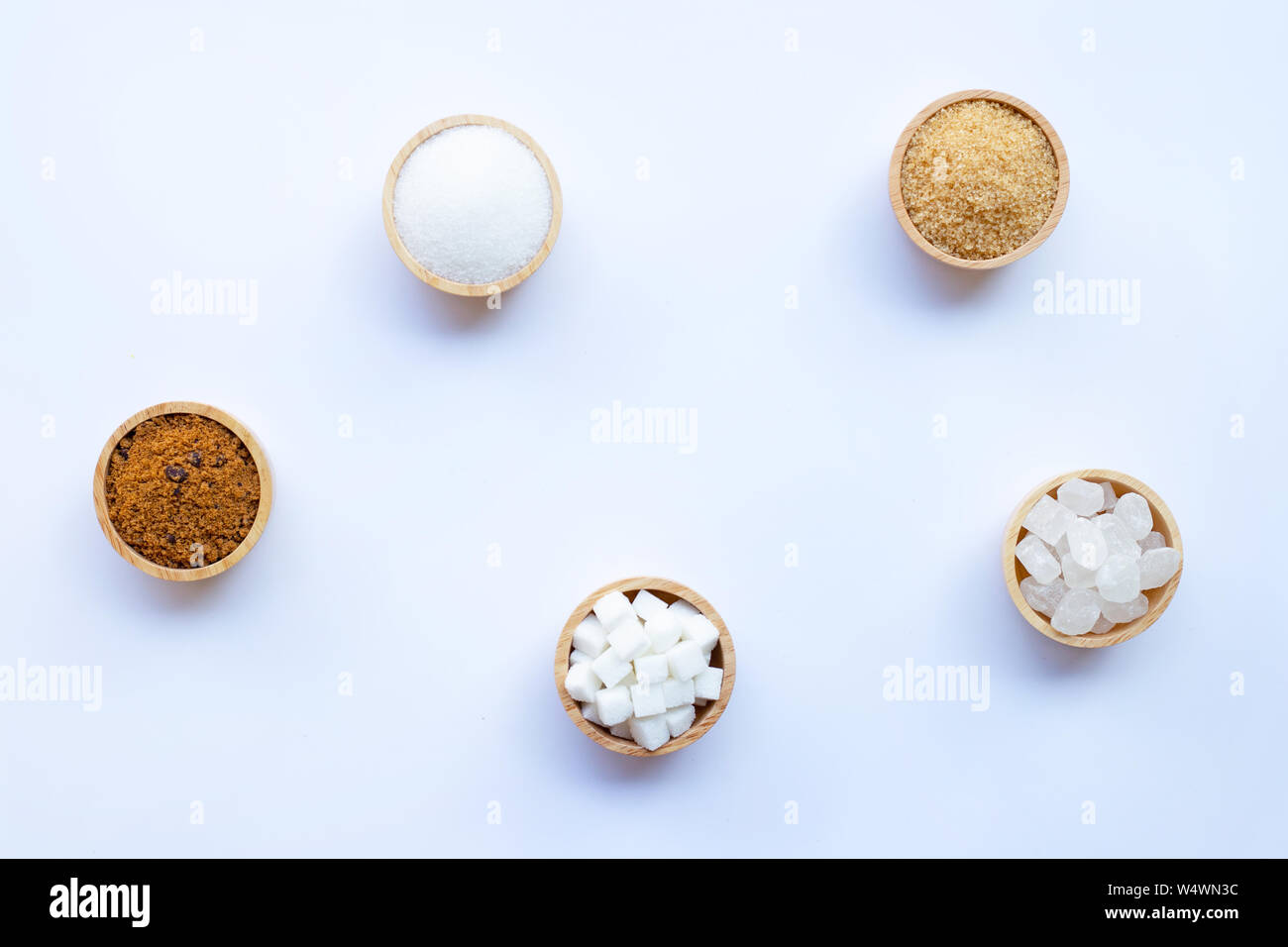 Various types of sugar on white background Stock Photo - Alamy