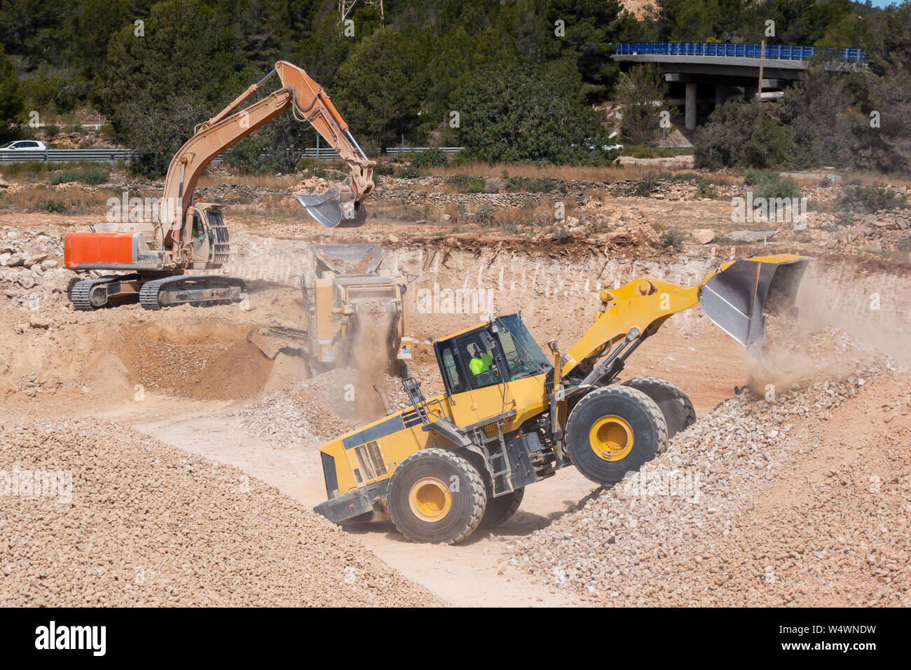 Excavator machines working in the construction site Stock Photo - Alamy