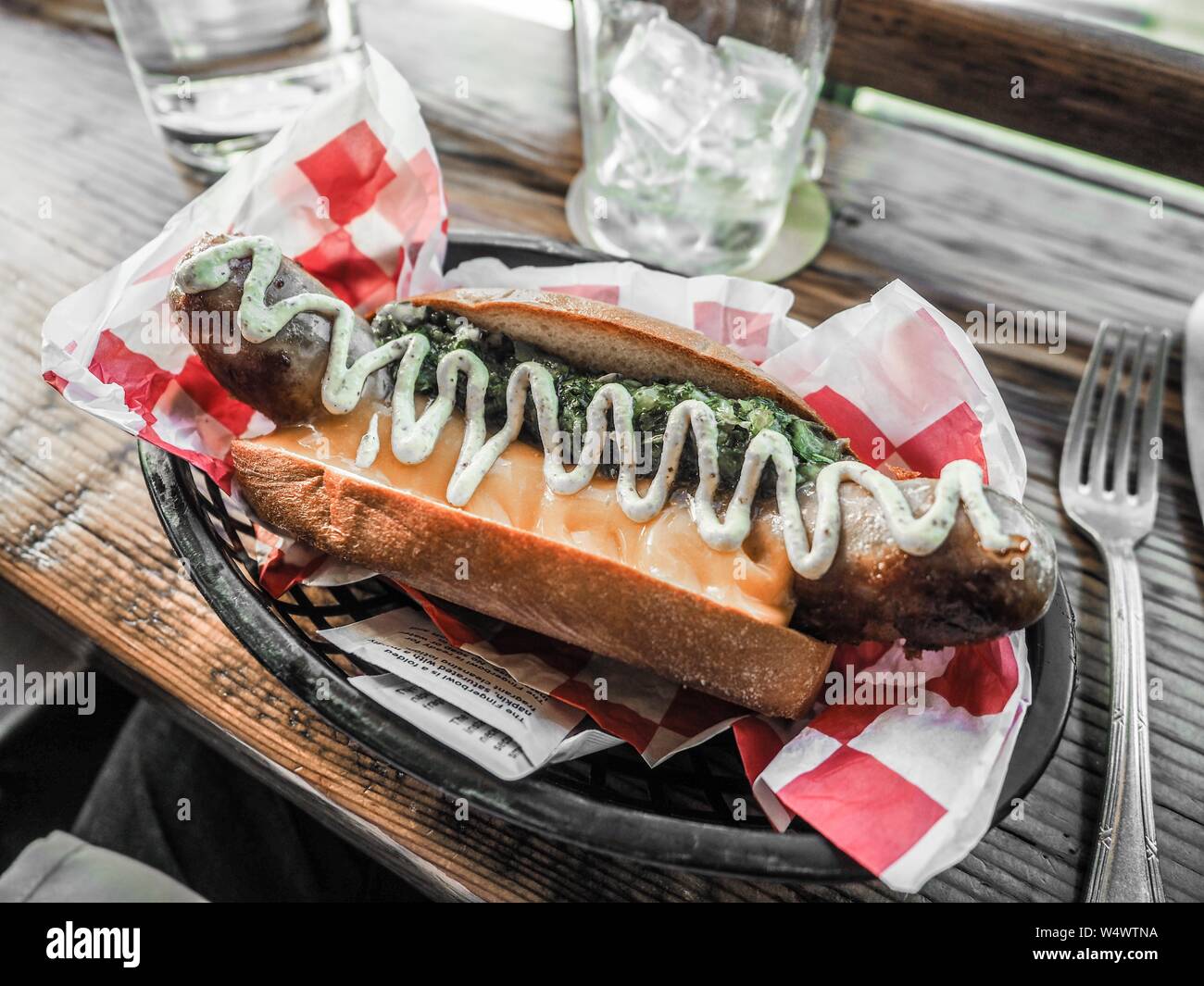 Footlong Sausage Sandwich with cheese in a tray with red and white ...