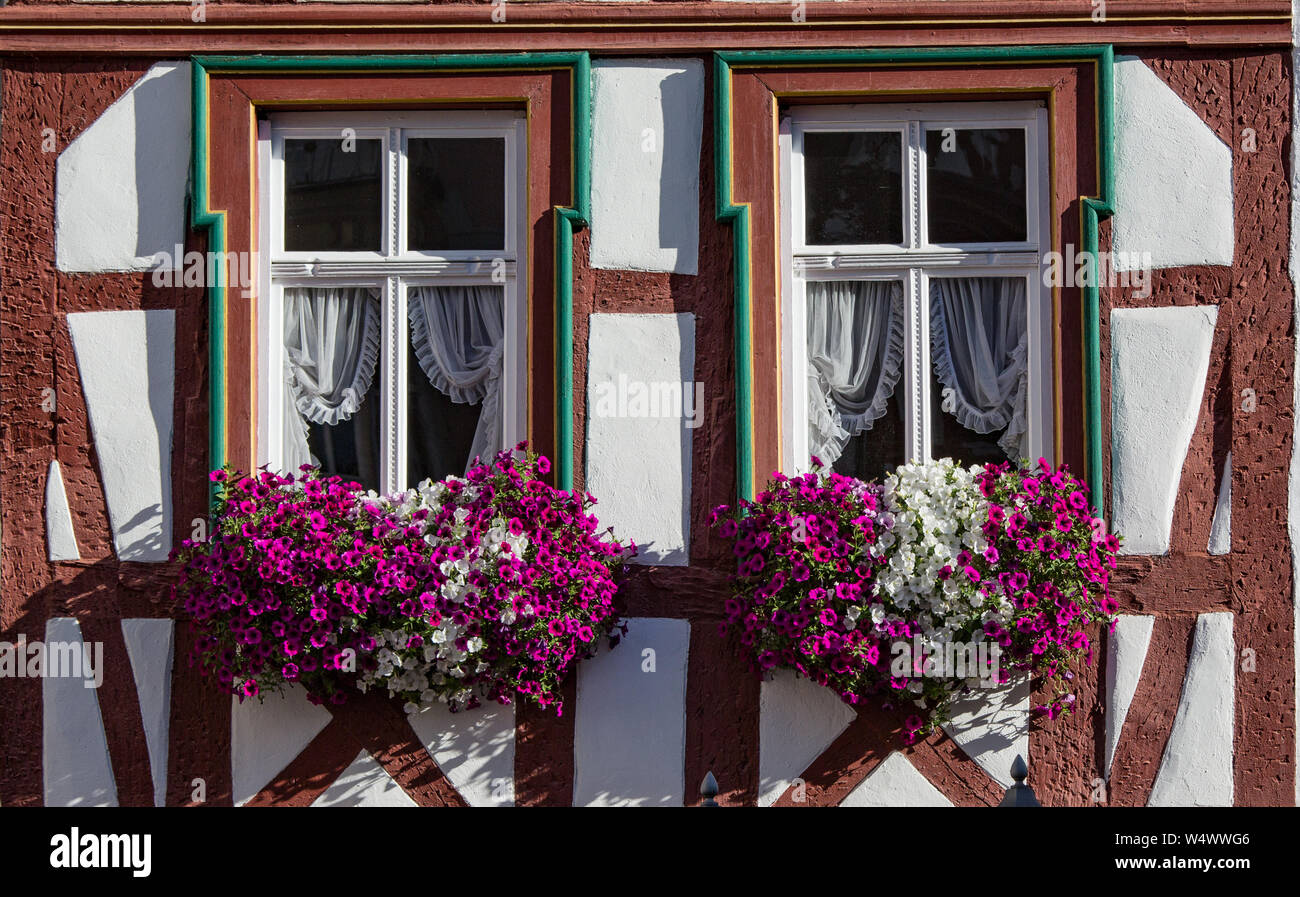 Decorative windows in Bernkastel, Germany accented with. colorful ...