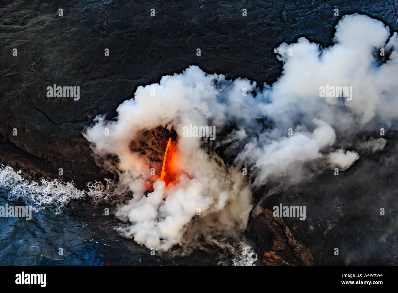 Hot lava falls into the Pacific Ocean causing explosions and gases to ...
