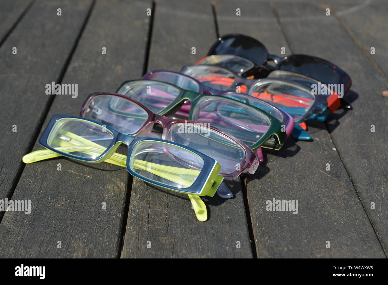 Large number of different framed folded spectacles glasses arranged in ...