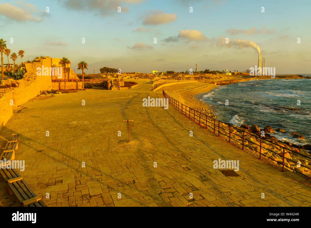Sunset view of the beach promenade and the old port in Caesarea ...