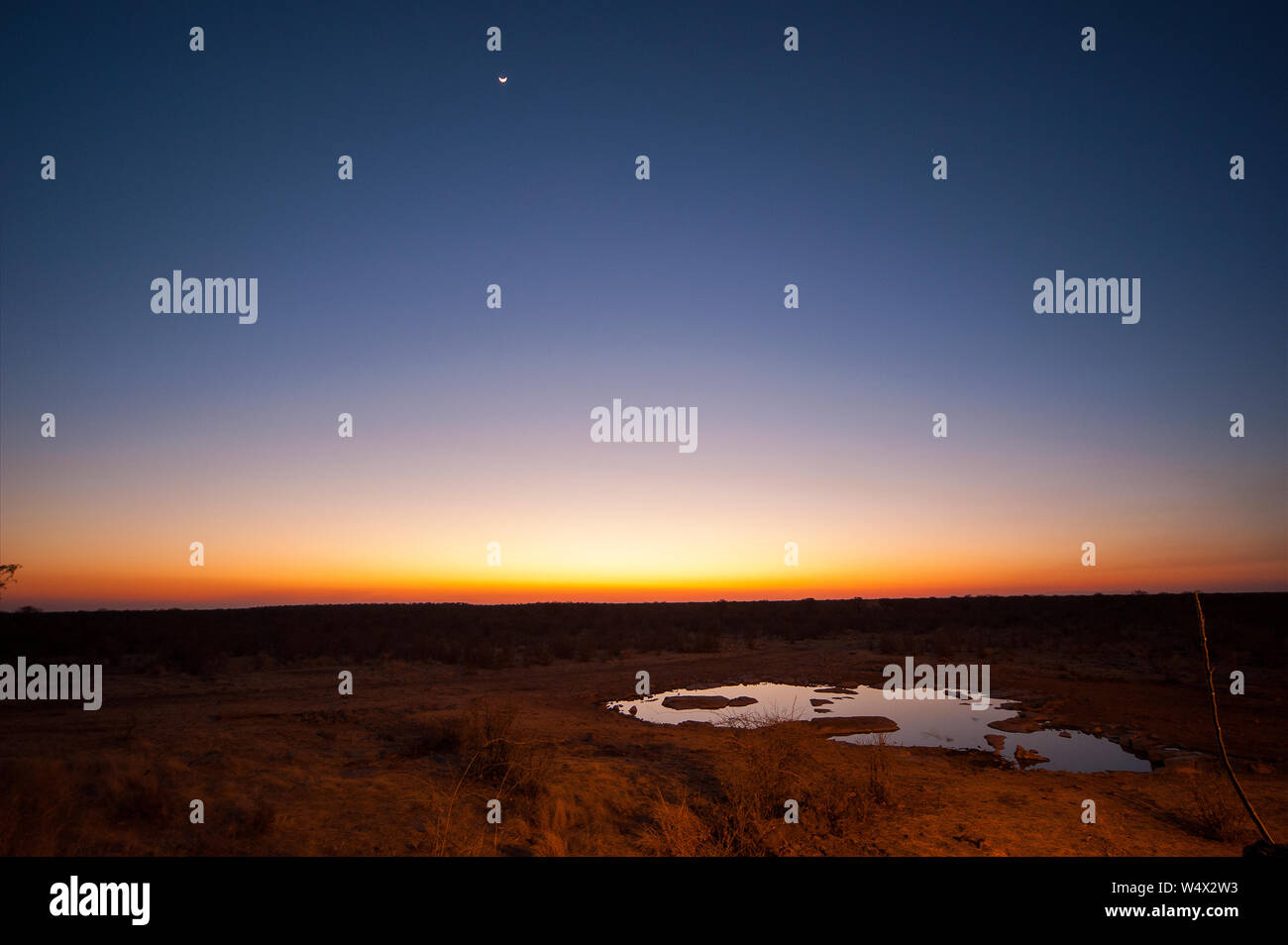 Sunset at Moringa waterhole, Halali, Etosha National Park, Namibia ...