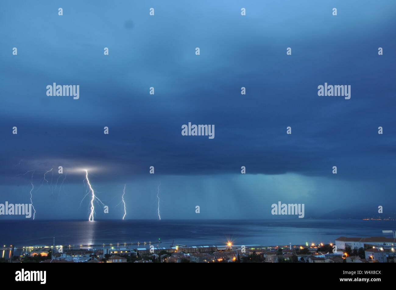 Thunderstorm and stormy clouds with rain in the night. Storm clouds ...