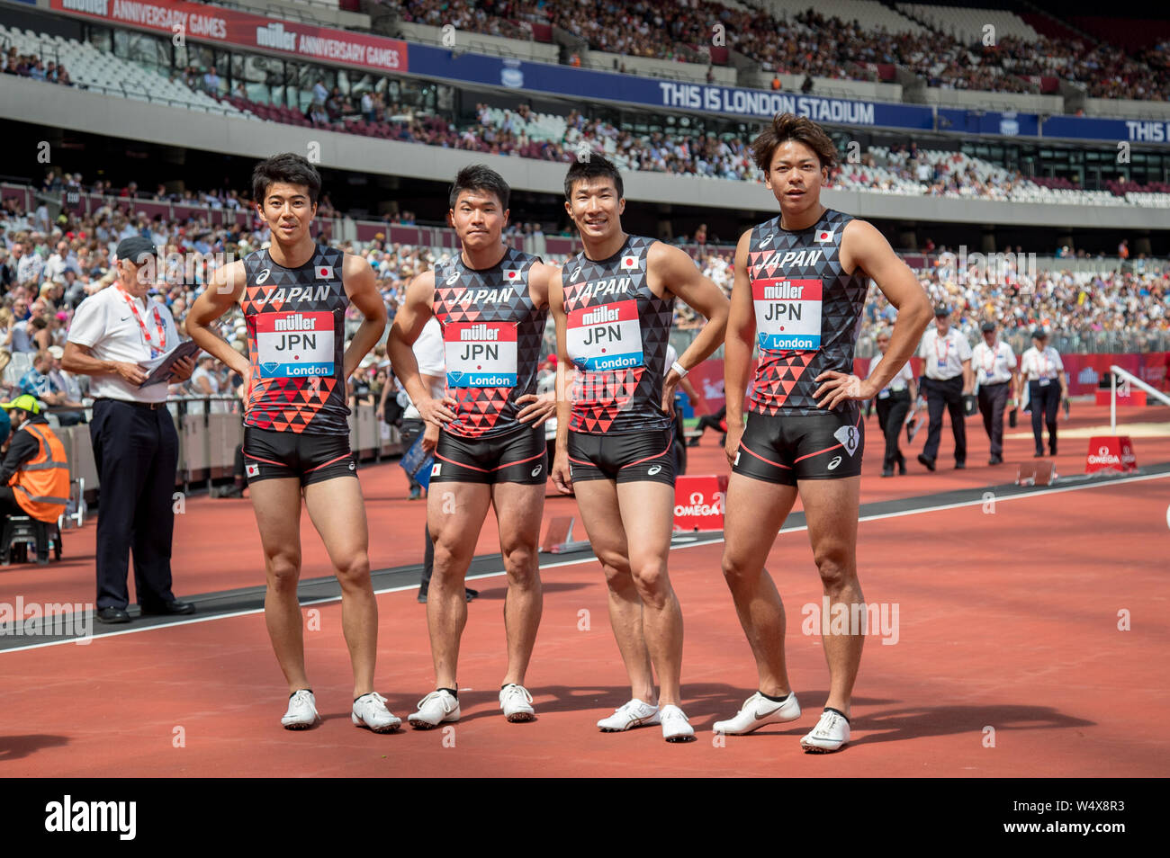 The Japan team pose for a photo after winning a silver medal in the ...