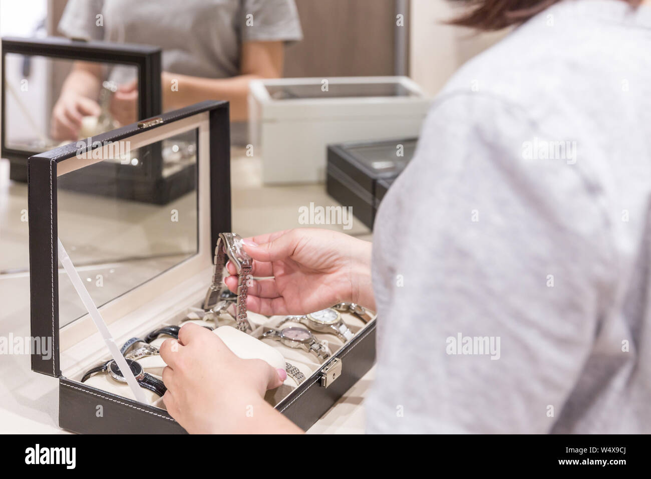 Hand trying wrist watch hi-res stock photography and images - Alamy