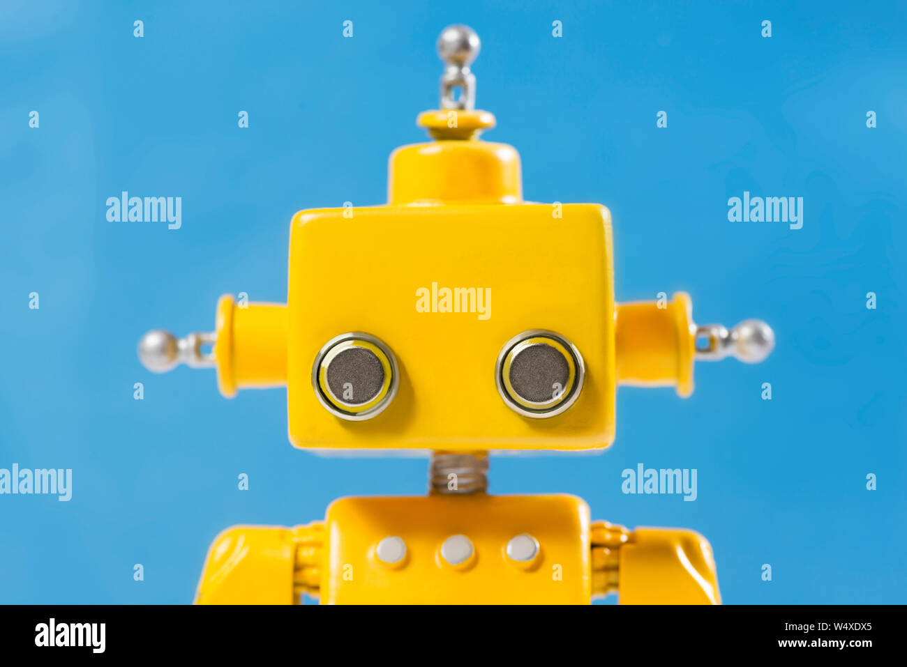 Retouched version of Portrait of a Cute, yellow, handmade robot on a ...