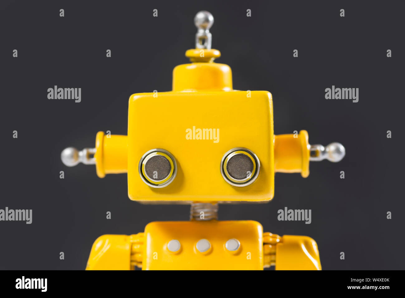 Retouched version of Portrait of a Cute, yellow, handmade robot on a ...
