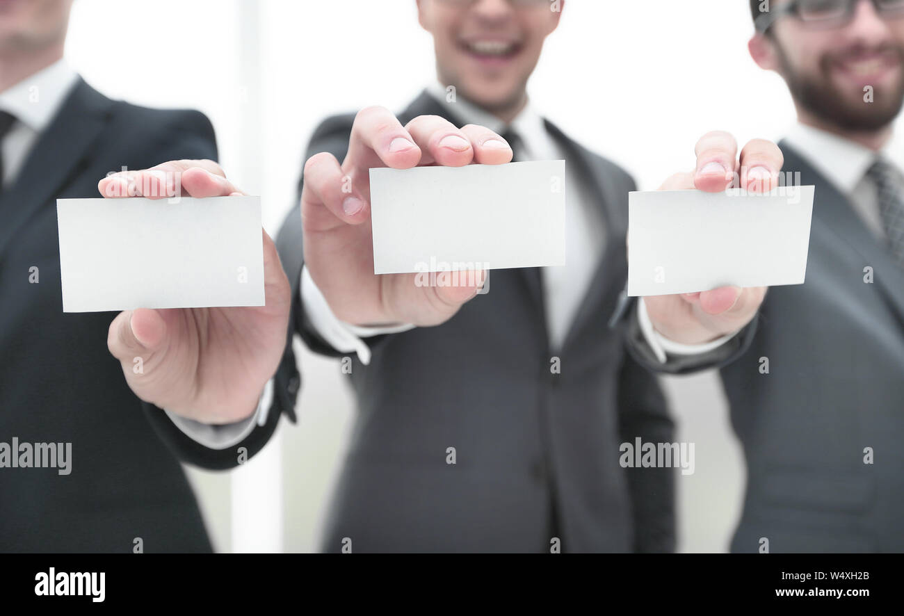 three business partners showing their business card form Stock Photo ...
