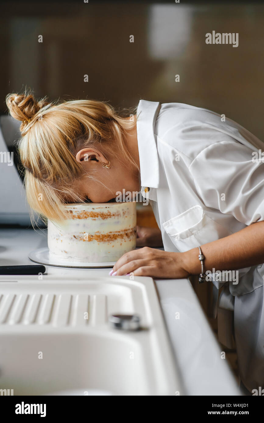 The girl fell face in the cake Stock Photo - Alamy