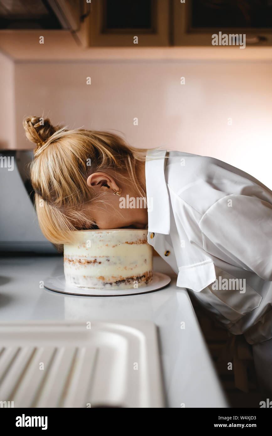 The girl fell face in the cake Stock Photo - Alamy