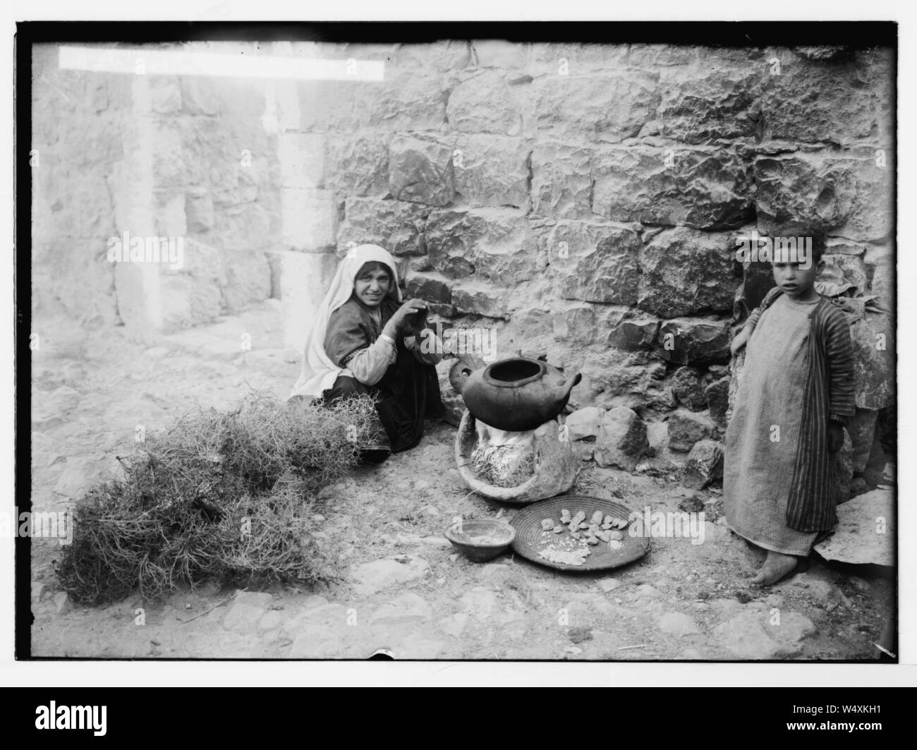 Costumes, characters, etc. Cooking the evening meal Stock Photo - Alamy