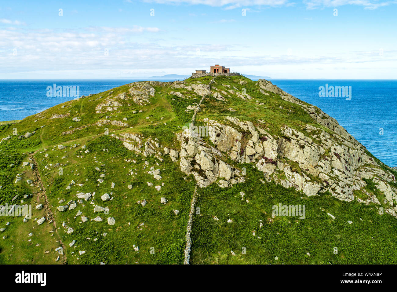 Torr Head headland, rocky cliff and peninsula with ruins of old fort in ...