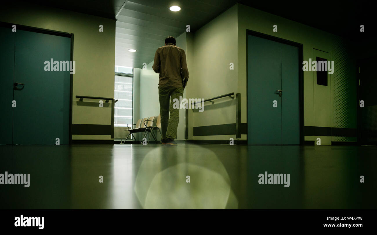 Sad people hospital hallway hi-res stock photography and images - Alamy