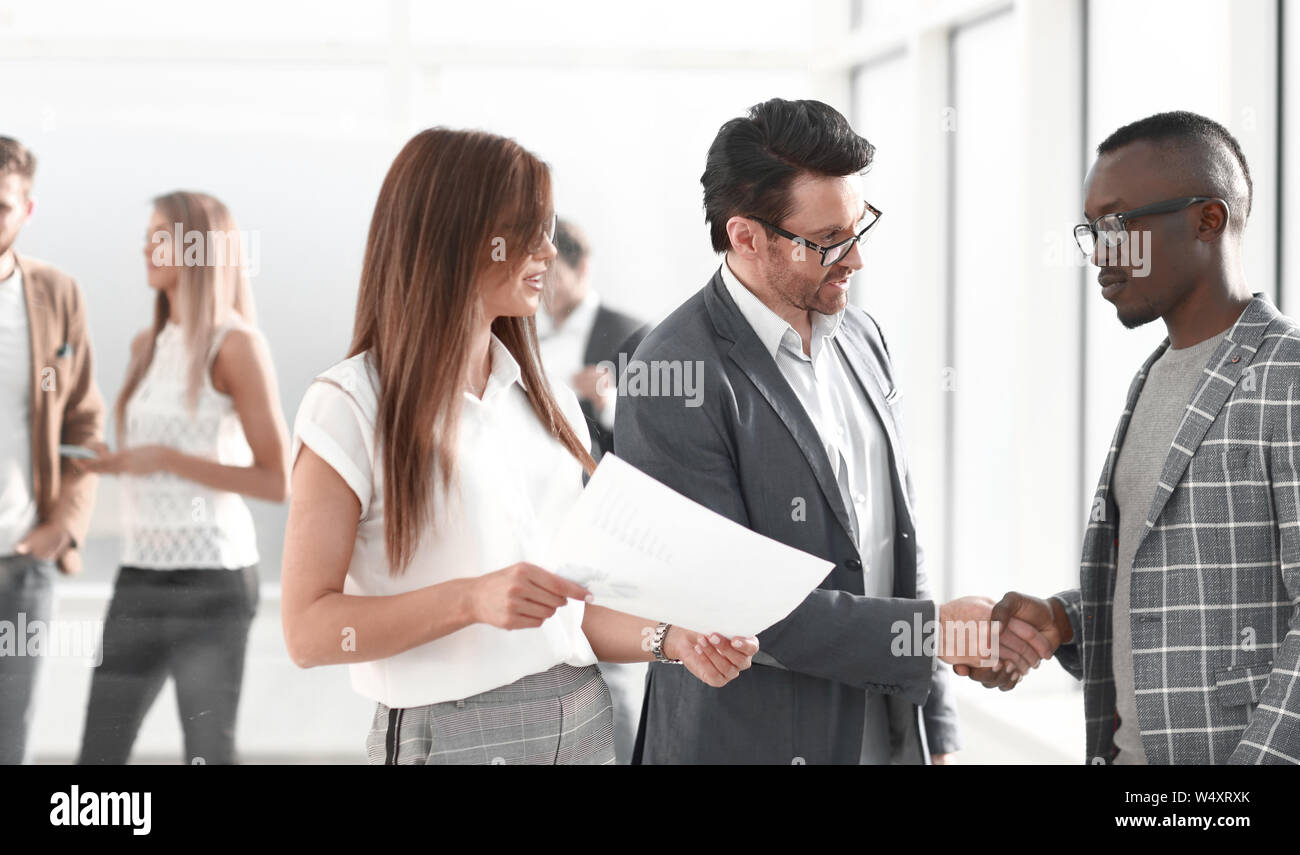 handshake Manager and client in the office Stock Photo - Alamy
