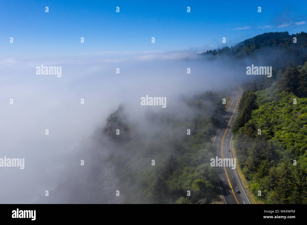 Seen from a bird's eye view, the foggy marine layer seeps over the ...