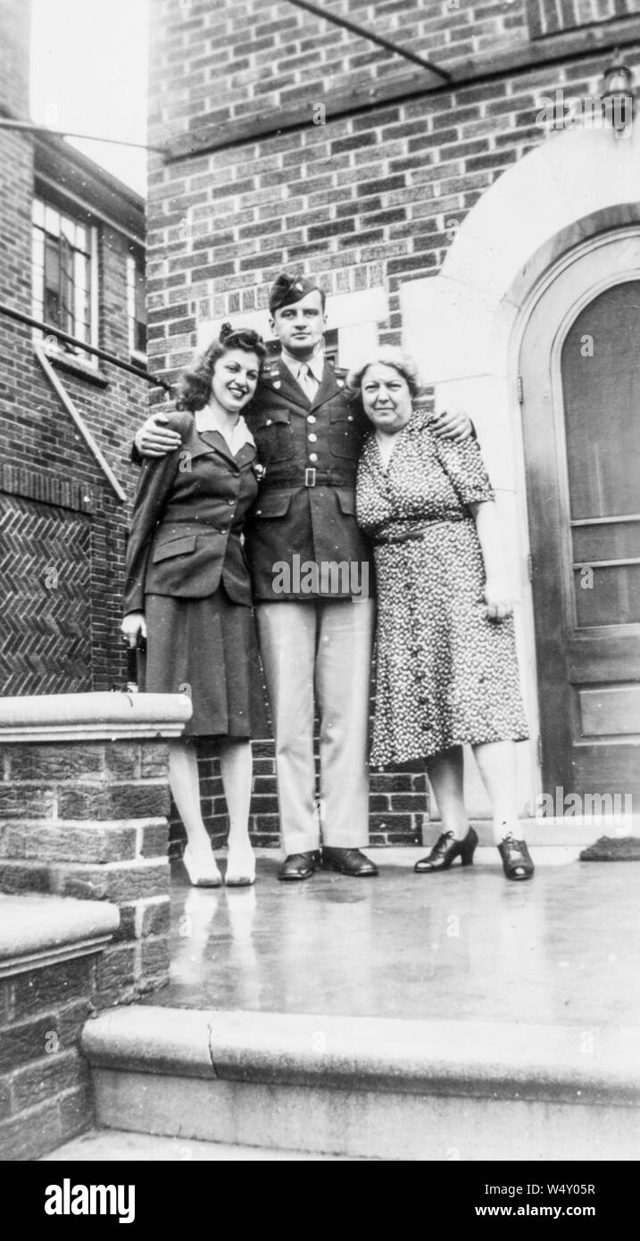 Three women stand in Black and White Stock Photos & Images - Alamy