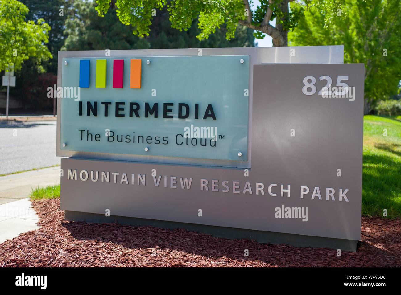 Sign with logo at entrance to headquarters of business telephony ...