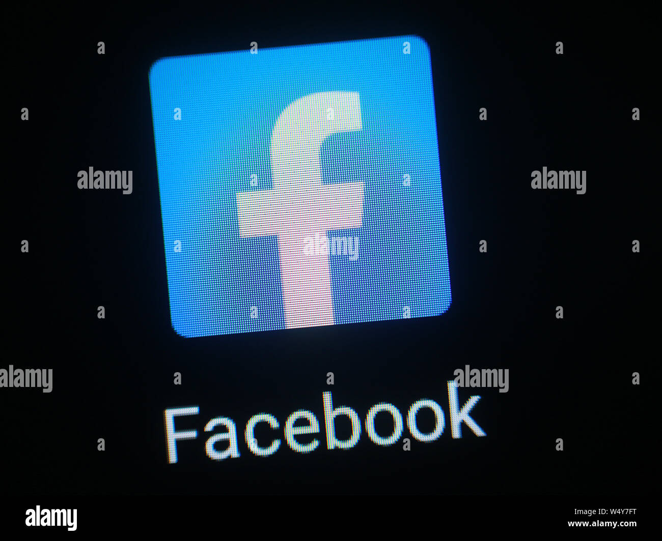Facebook application icon on computer display Stock Photo - Alamy