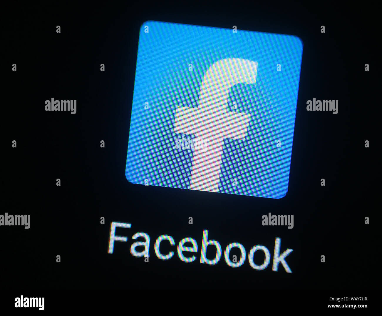 Facebook application icon on computer display Stock Photo - Alamy