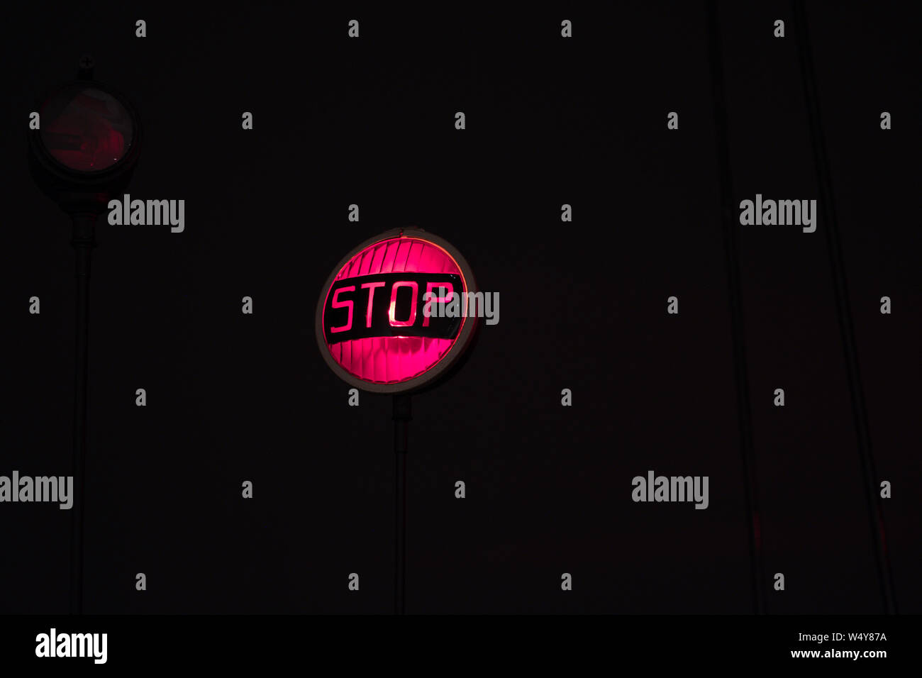 Red stop light in dark room - Takis exhibition - Tate Modern - London ...