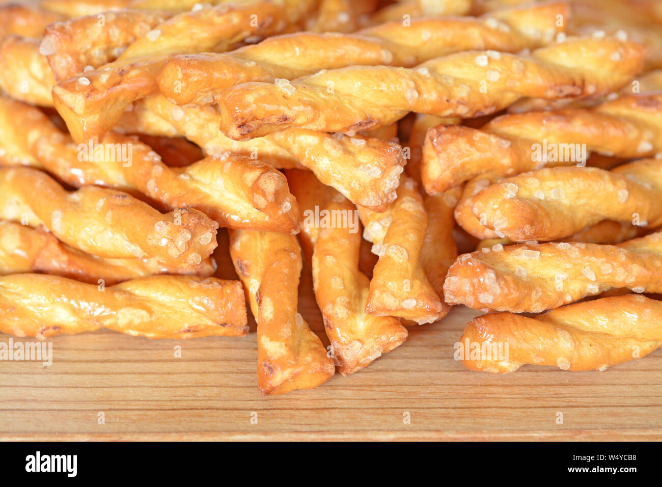 Many of Pretzel sticks on wooden table Stock Photo - Alamy