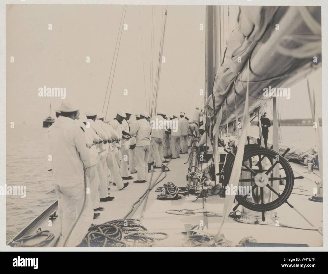 Crew handling rigging on the yacht Reliance, winner of 1903 America's ...