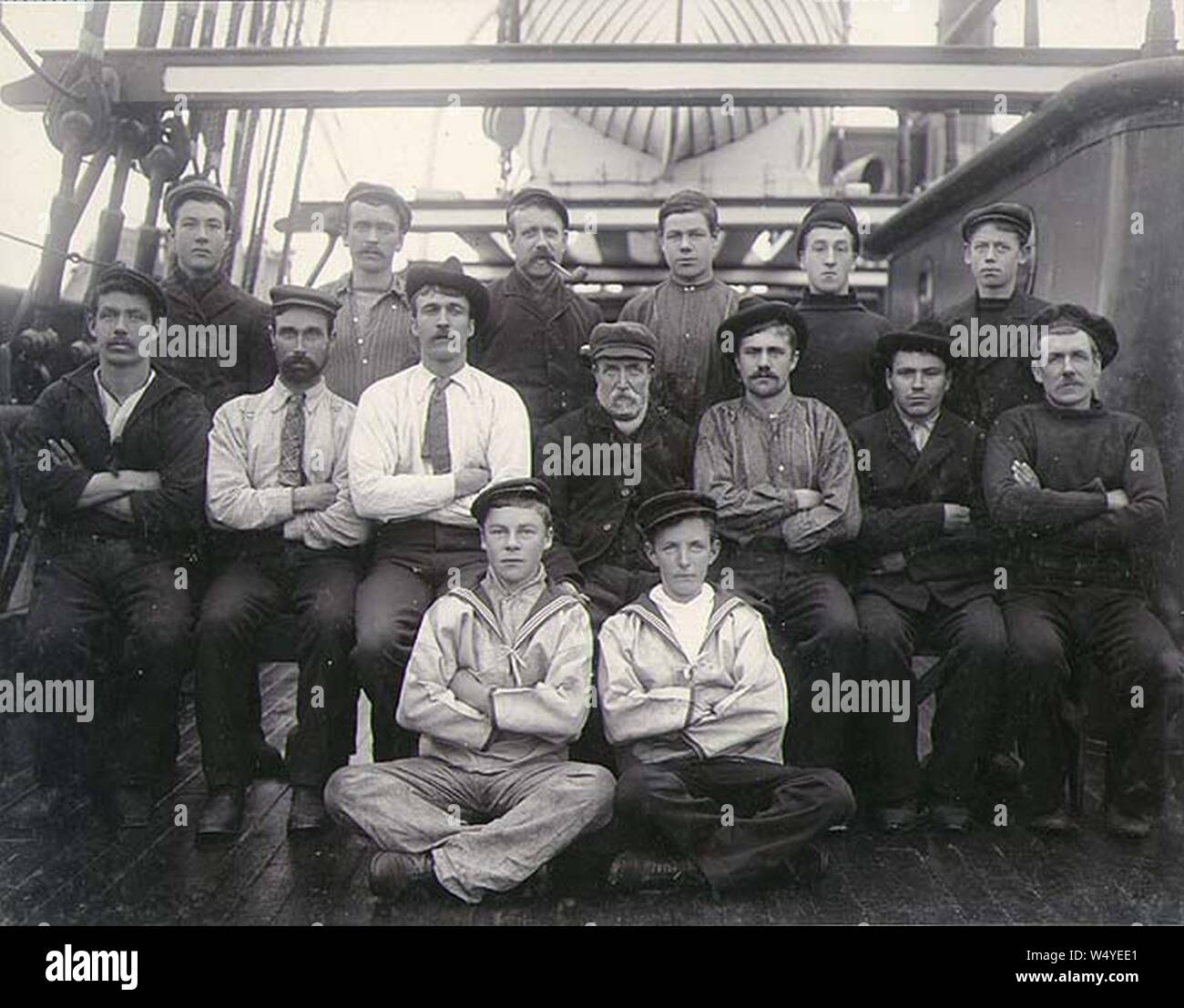 Crew of the four-masted bark MOZAMBIQUE seated on deck Puget Sound port ...