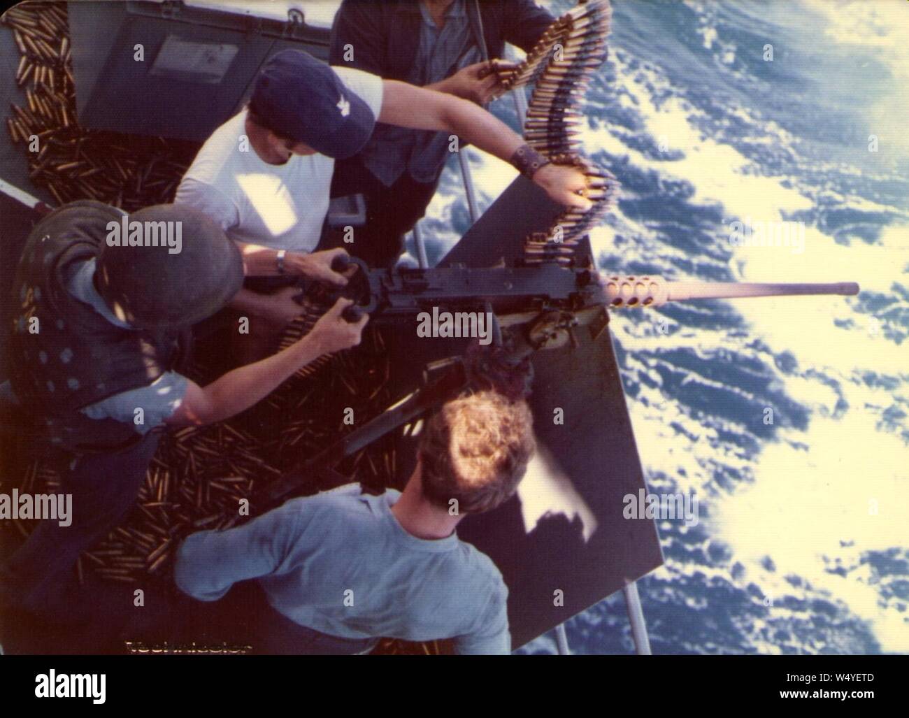 Crewmen aboard USS Hanson (DD-832) fire a Browning M2 in the Gulf of ...