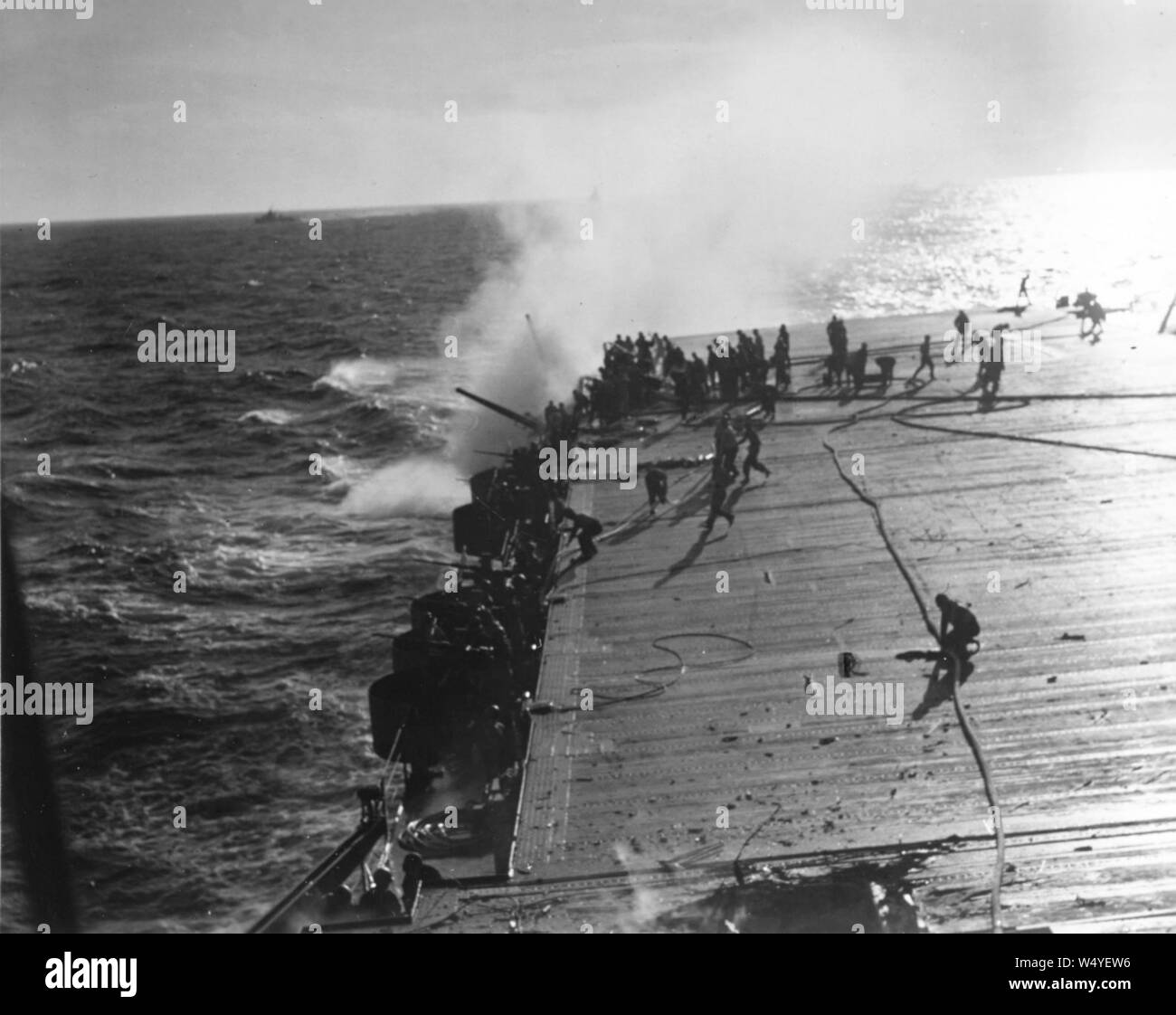 Crewmen fight fire on USS Enterprise (CV-6) on 24 August 1942 (NH ...