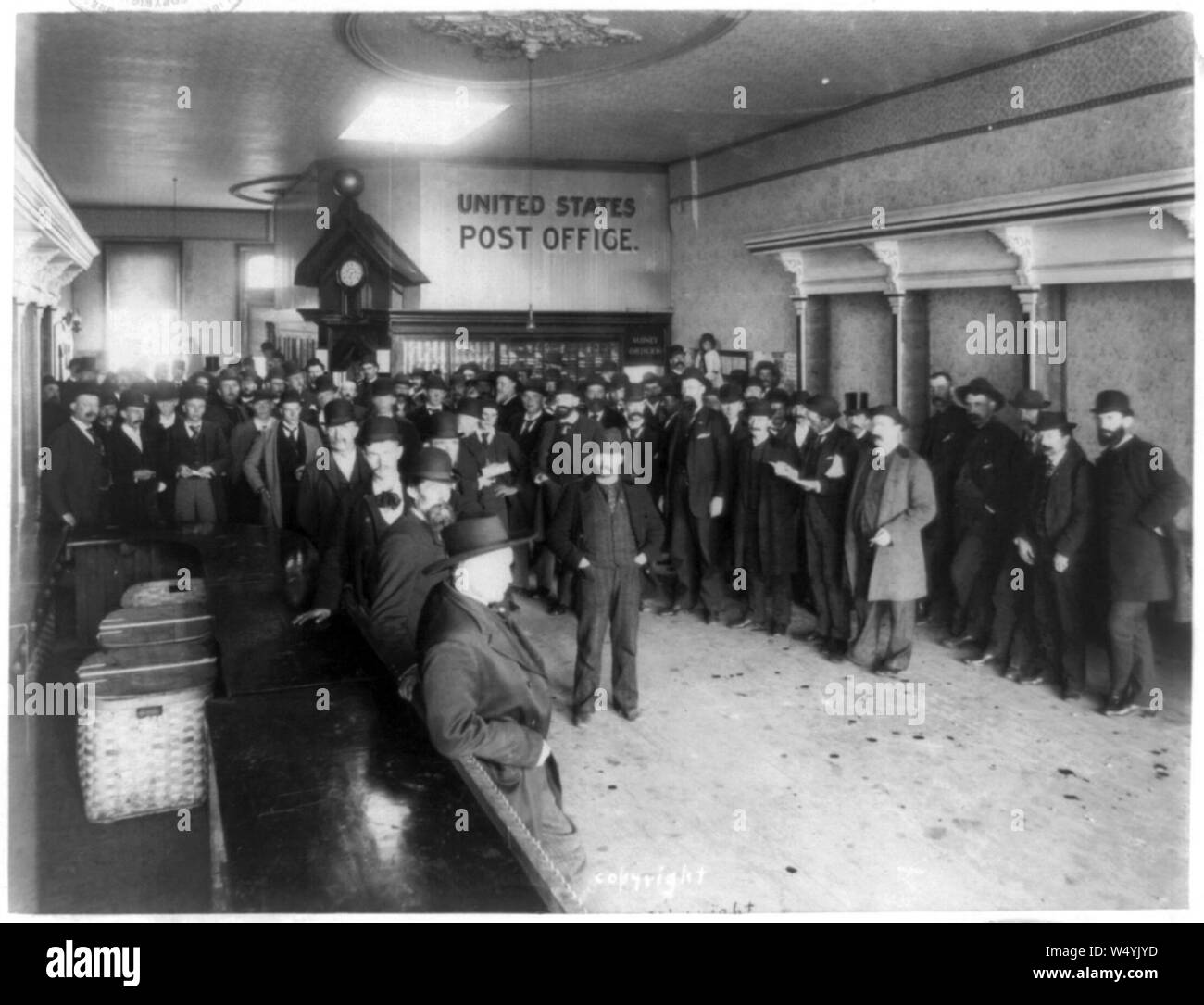 Crowd of people in post office Stock Photo - Alamy