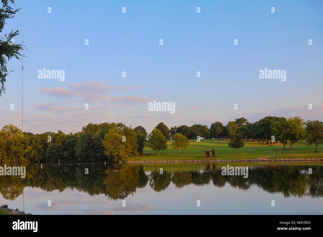 A lake in front of a park at sunset in Concord North Carolina Stock ...