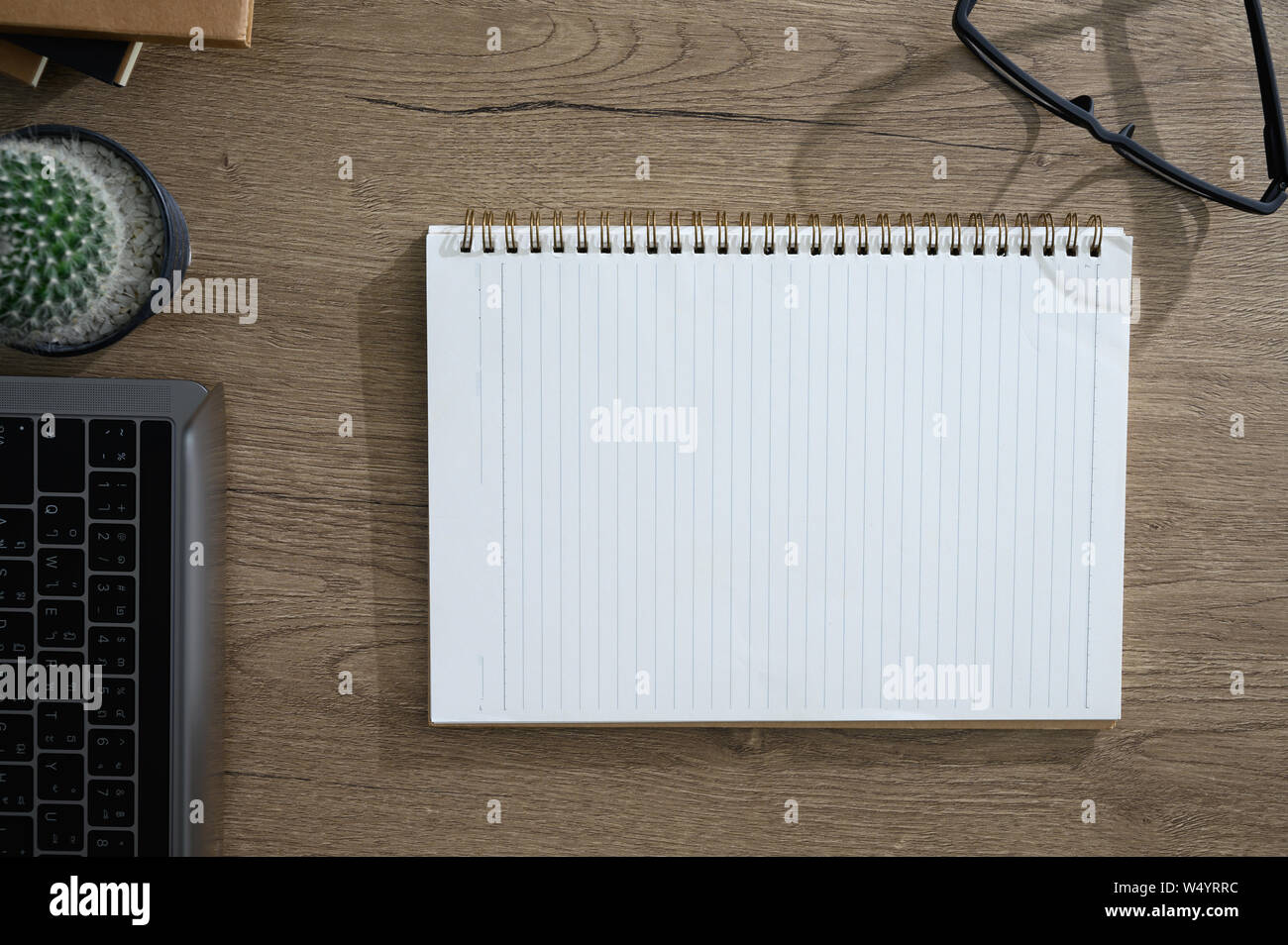 table view with a laptop Office desk header Stock Photo - Alamy