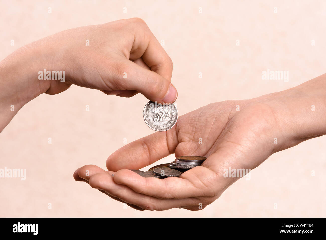 Woman giving money to another woman hi-res stock photography and images ...