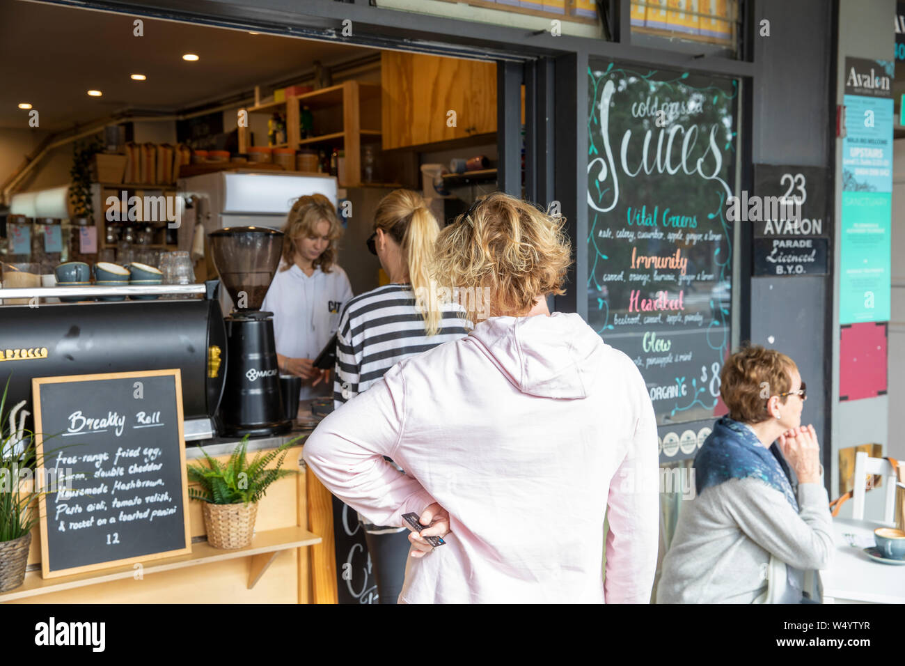 Ladies ordering coffee and breakfast at a small cafe in Avalon beach ...