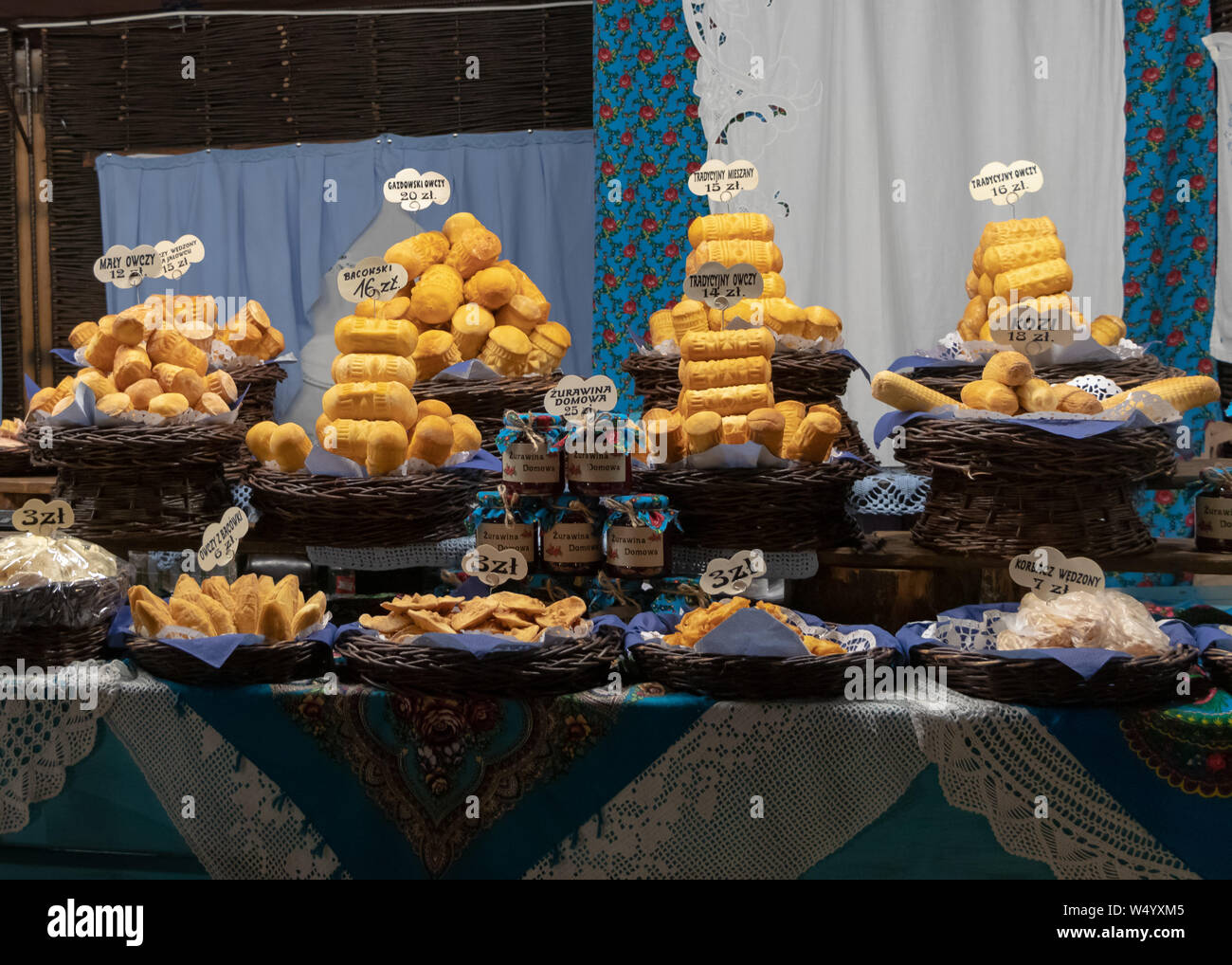 Cheese vendor at market square Stock Photo - Alamy