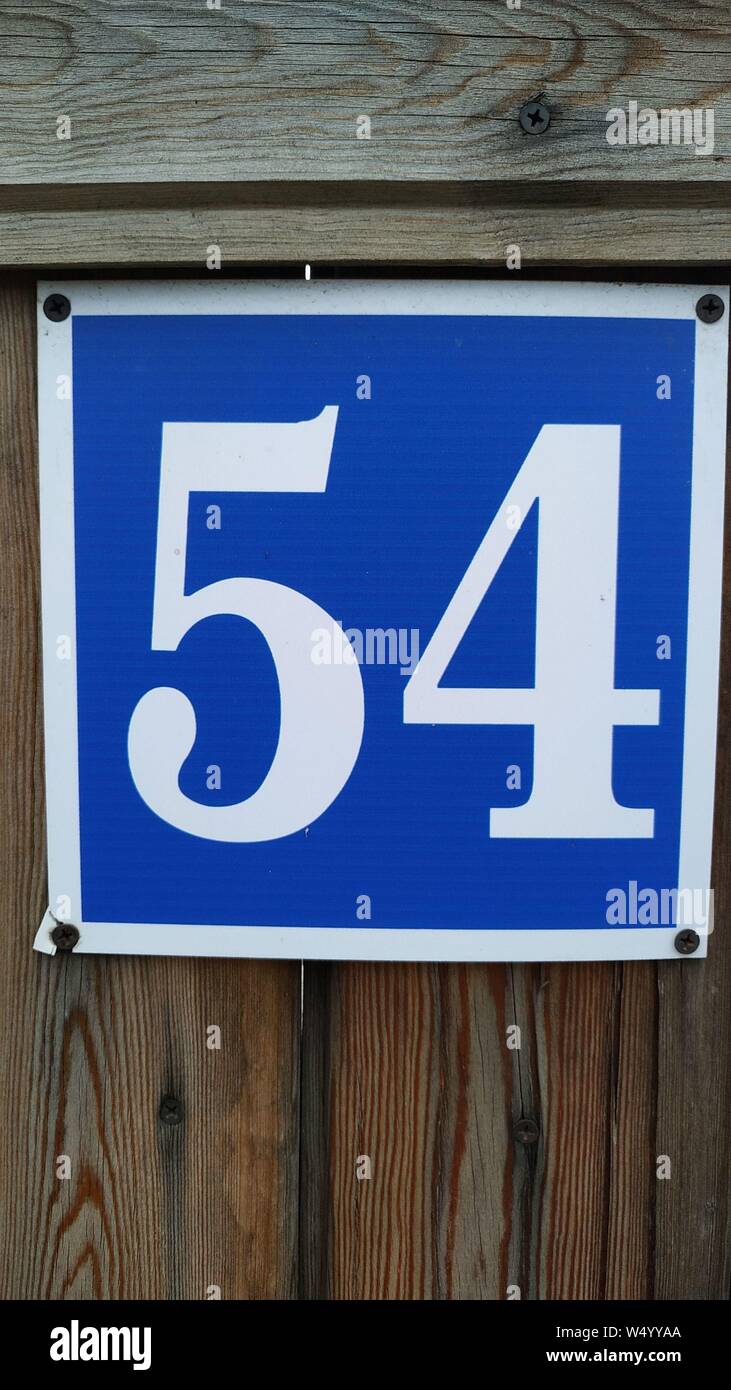 The number 54 is white in blue frame Stock Photo - Alamy