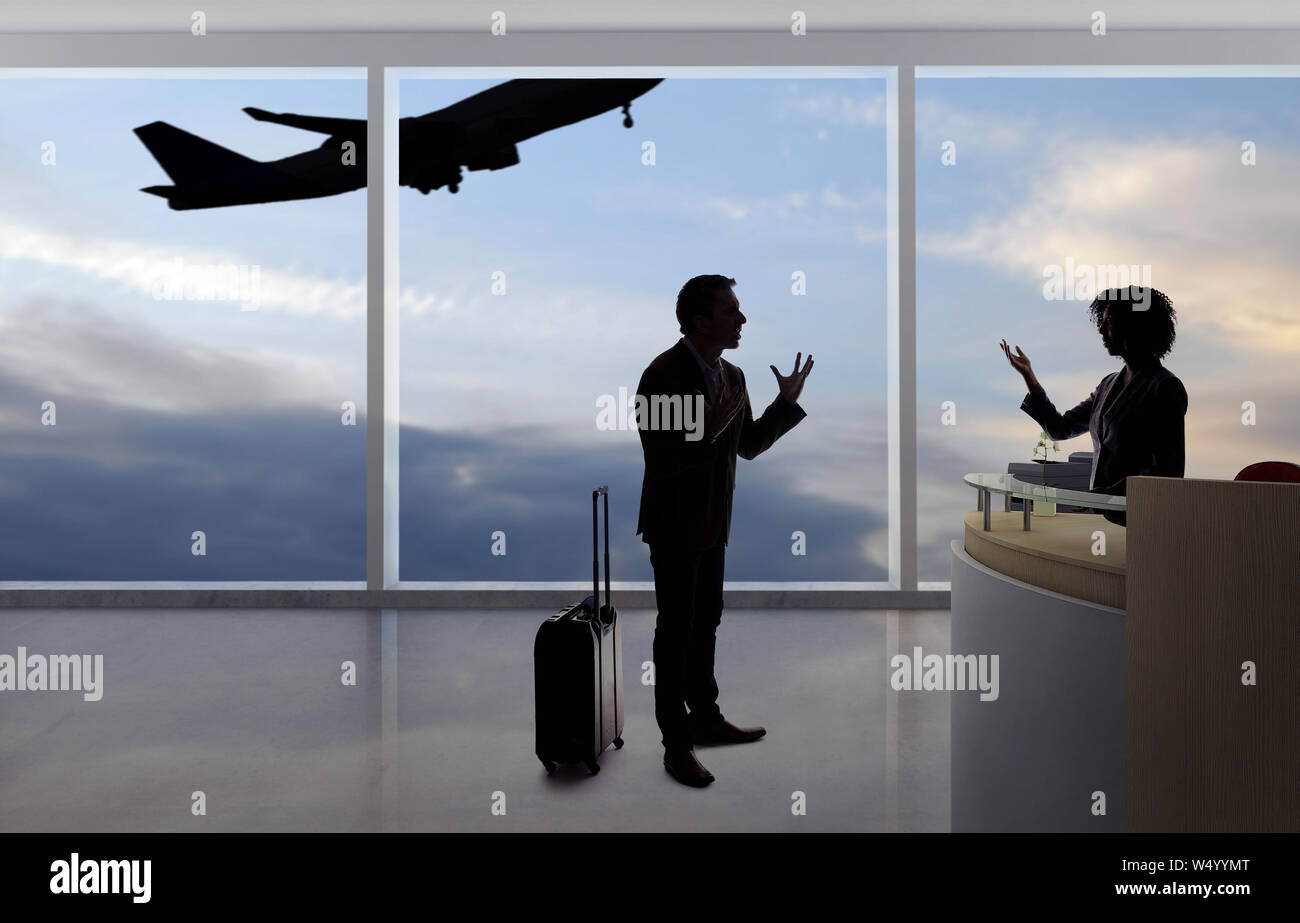 Stressed out businessman passenger arguing with a flight attendant or ...