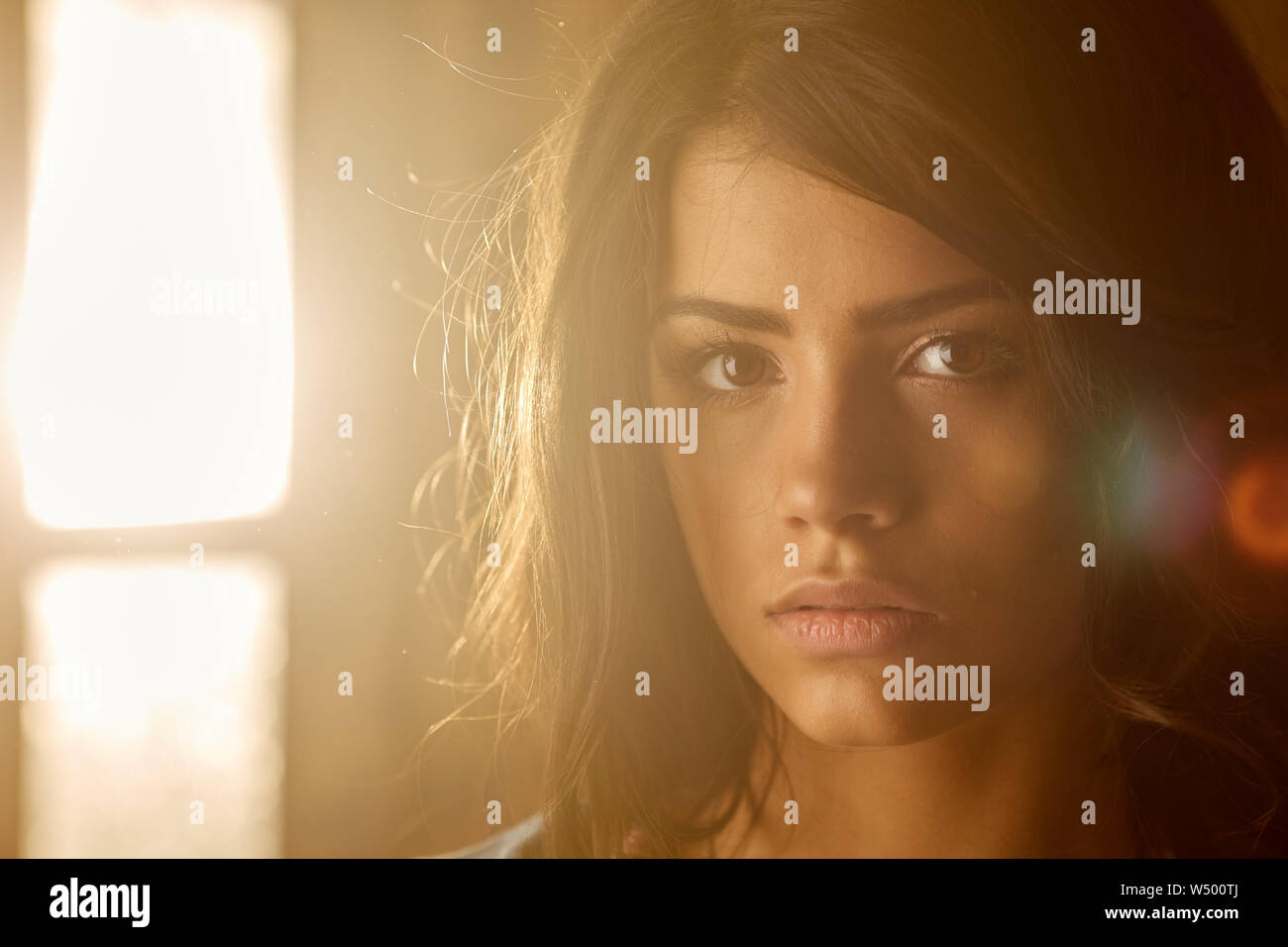 beautiful sad girl by the window on a sunny day Stock Photo - Alamy