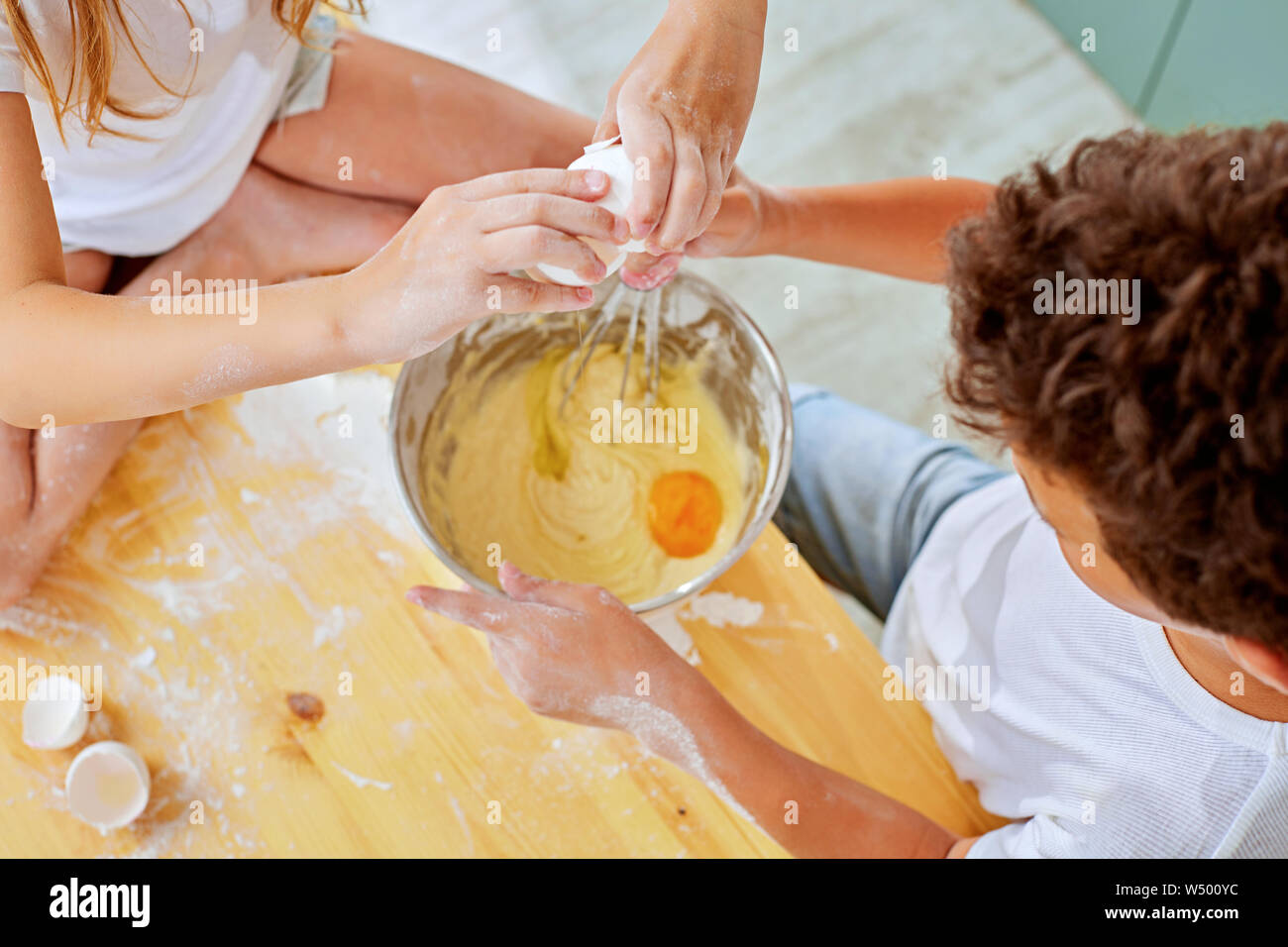 Child adding flour hi-res stock photography and images - Alamy